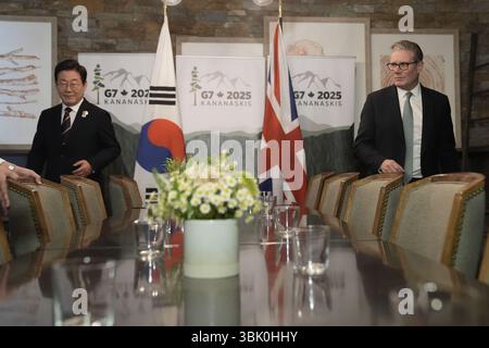 South Korean President Lee Jae-Myung, center right, receives a letters of appointment during a ...