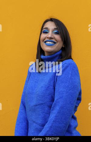 Beauty portrait of female model with vivid makeup on gray background ...