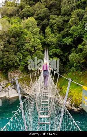 Photograph of a suspension bridge at the Cesspool, Arahura River, near ...