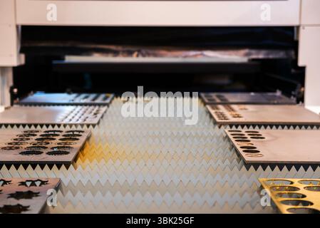 Laser cutter cutting metal plates in a factory Stock Photo - Alamy