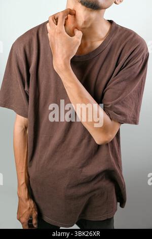 Man scratching his neck, portrait isolated on white background Stock ...