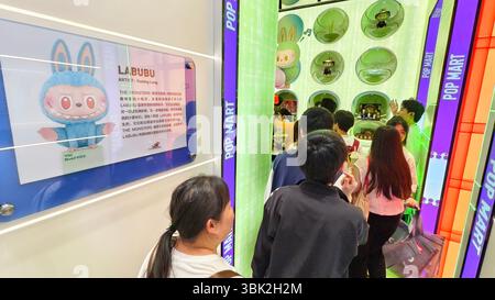 Customers purchase Labubu products in the global flagship store of POP ...