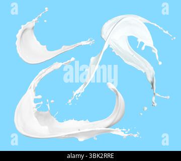 Milk splashes on light blue background, set Stock Photo - Alamy