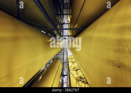 Industrial interior with welded silos from above Stock Photo - Alamy