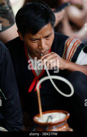 Traditional ceremony in a Bahnar ethnic village in the Kontum region ...