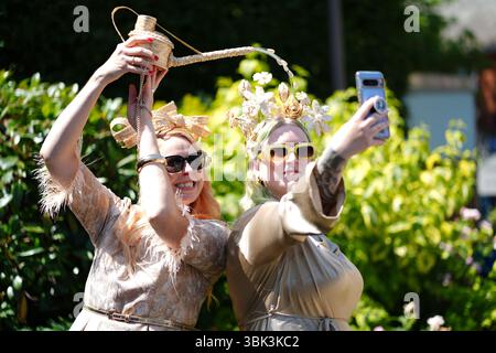 Racegoers pose for a selfie on day two of Royal Ascot at Ascot ...