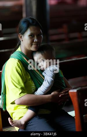 Bahnar woman from ethnic minorities praying in church. Kon Tum ...