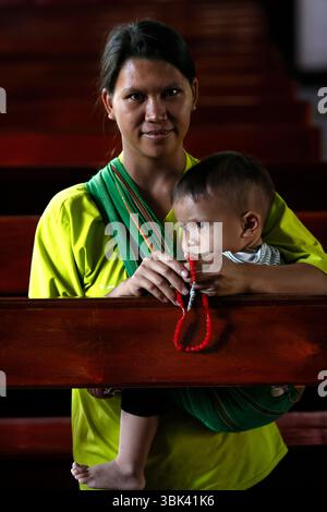 Bahnar woman from ethnic minorities praying in church. Kon Tum ...