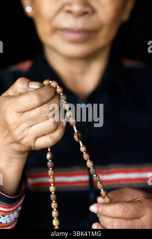 Bahnar woman from ethnic minorities praying in church. Kon Tum ...