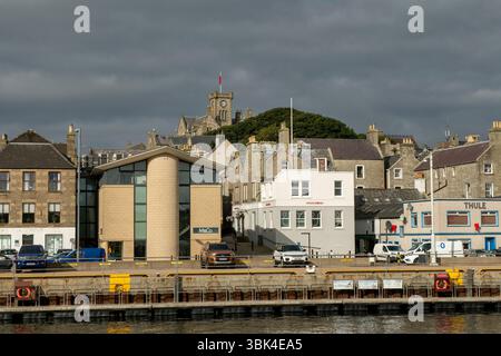Lerwick Harbour basks in early sunshine as dark, brooding skies loom ...