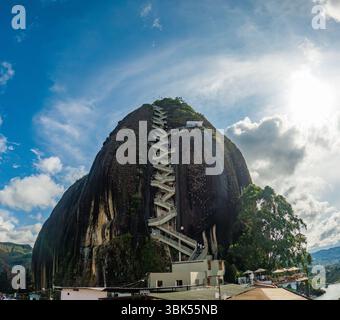 Stunning view of Peñol Rock in Guatape, Antioquia, under a bright blue ...