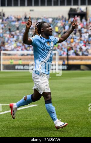 Jeremy Doku of Manchester City celebrates after scoring to make it 3-0 ...