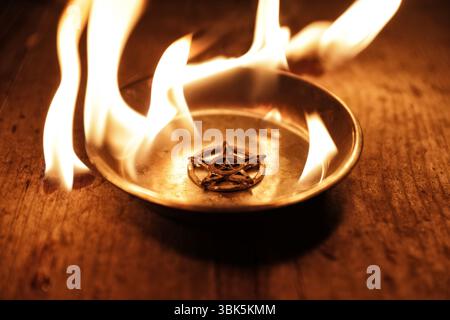 Old pentagram burning in flames close-up photo Stock Photo - Alamy