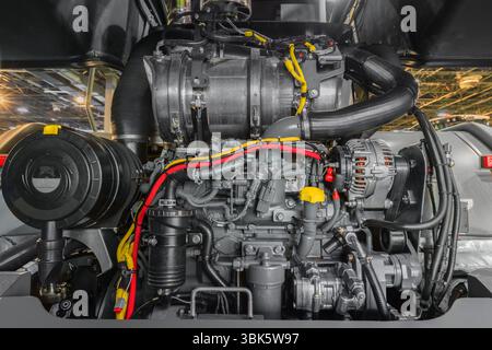 Detail photo of black car engine under the hood Stock Photo - Alamy