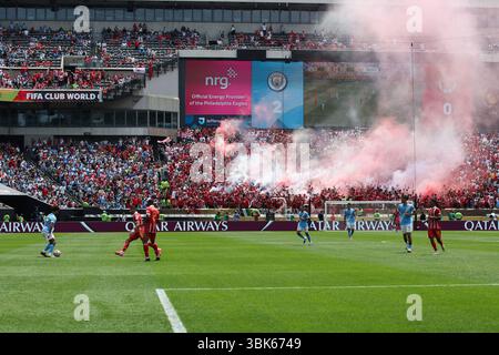 Fans of Wydad AC light flares and smoke bombs as they show their ...
