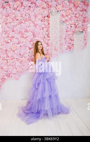 An elegant flowing brown tulle gown showcased as an isolated item on a ...