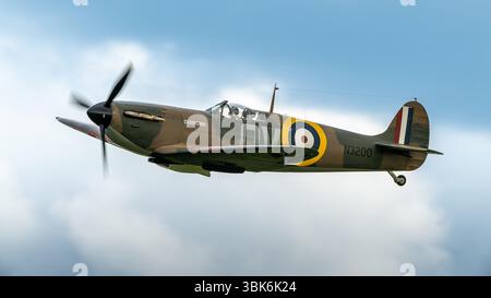 Supermarine spitfire plane Spitfire Mk IA flying, side view, Duxford ...