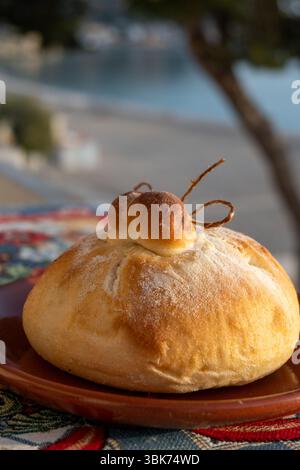 Fresh baked bread in burrata cheese shape filled with tomatoes ...