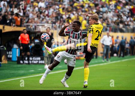 Daniel Svensson of Borussia Dortmund competes for the ball with Erick ...