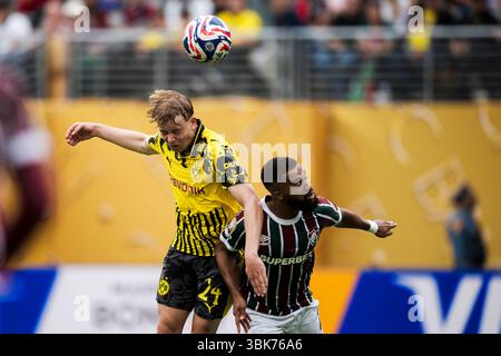 Daniel Svensson of Borussia Dortmund competes for the ball with Erick ...
