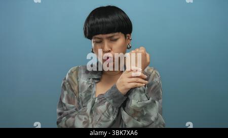 Asian woman experiencing wrist pain in office for work health issues ...