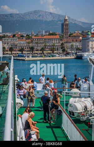 Split, Croatia. 19th June, 2025. People are seen during ferry transport ...