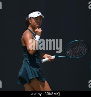 Mingge Xu during her match against Emma Raducanu on day one of the 2025 ...
