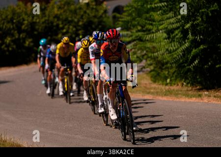 The pack rides cycles during the stage 8 of the Giro Next Gen 2025 ...