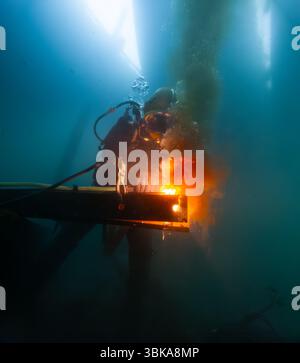Underwater welding in deep ocean depths closeup Stock Photo - Alamy