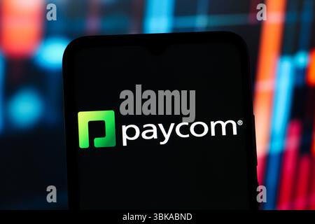 In this photo illustration, the Paycom Software, Inc. logo is seen on a ...