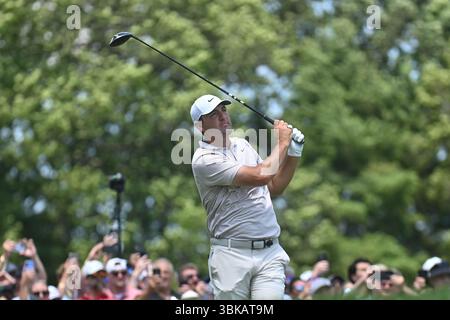 Scottie Scheffler watches his tee shot on the 15th hole during the ...