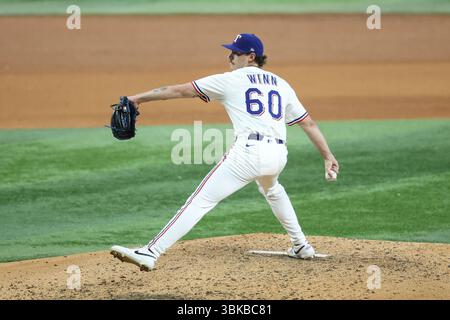 Texas Rangers pitcher Cole Winn throws to the Miami Marlins during the ...