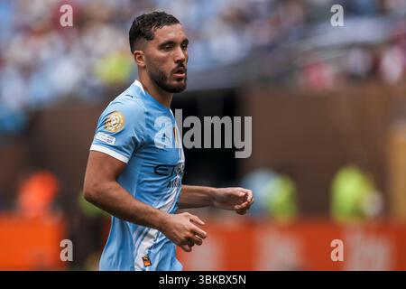 Rayan Cherki of Manchester City looks on during the Premier League ...