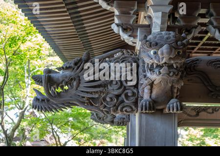 Intricate wooden dragon carving adorns Daisho-in Temple, blending ...