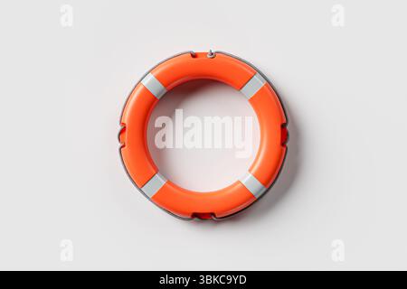 White Life Buoy and Silver Nautical Anchor on a Blue Wooden Plank Wall ...