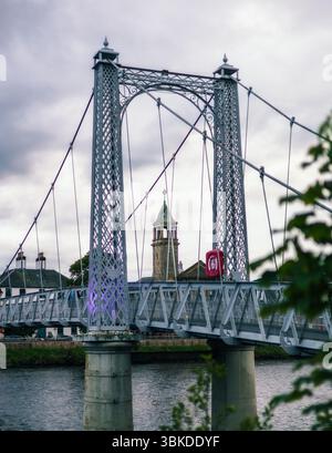 The Greig street pedestrian bridge spans the Ness river in Inverness ...