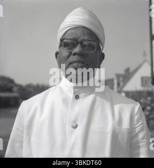 1950s, historical, male servant, man friday, Nepalse, standing for a ...
