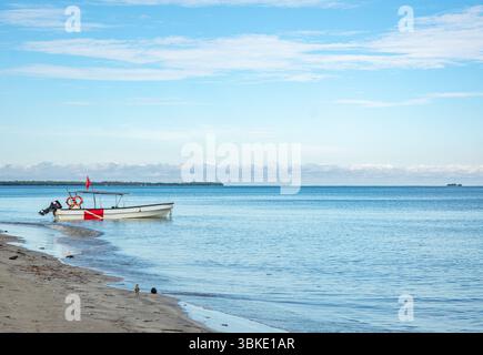 A tranquil beach in Rincon del Mar, Sucre, Colombia, featuring a small ...