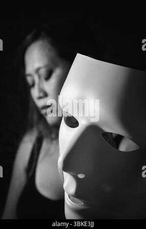 Black mask in the dark secretive ritual and mystery Stock Photo - Alamy