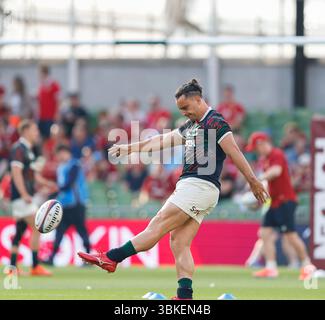 James Lowe of the British & Irish Lions, center, is tackled by ...