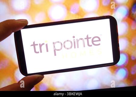 In this photo illustration, the Tri Pointe Homes (TPH) logo is seen ...