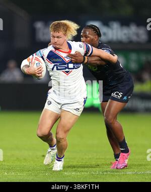 Wakefield Trinity's Caius Faatili tackled by Leeds Rhinos' Cameron ...