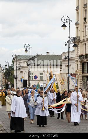 WHO: Catholic clergy and lay worshippers. WHAT: priests carrying the ...