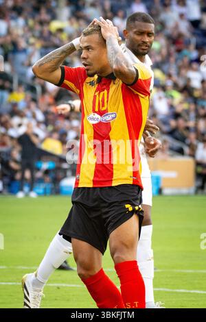 Yan Sasse of Esperance Sportive de Tunis is tackled by Malo Gusto of ...