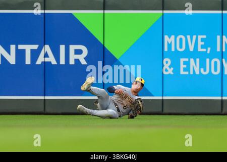 Milwaukee Brewers' Isaac Collins makes a sliding catch during a ...