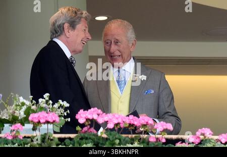 King Charles III with John Warren (left) talking to jockey Ryan Moore ...