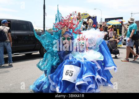 People dressed as mermaids and othet sea creatures pose for photos ...