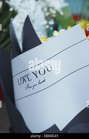 Bouquet of flowers with message you are my love on wooden table Stock ...