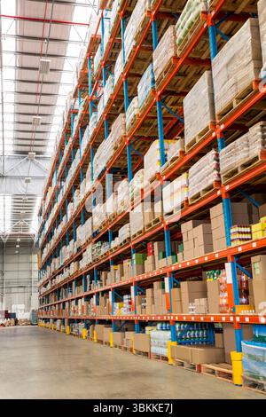 Cardboard boxes arranged on rack in factory Stock Photo - Alamy