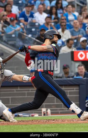 Toronto Blue Jays' Nathan Lukes gestures to the bullpen as he rounds ...